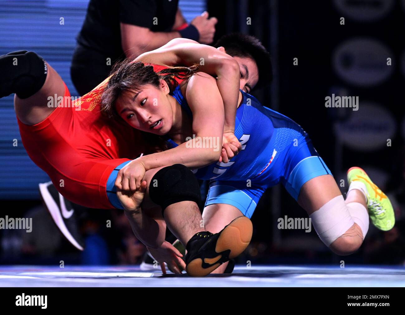 ZAGREB, CROATIA – FEBRUARY 02: Jiang Zhu of China (red) competes ...