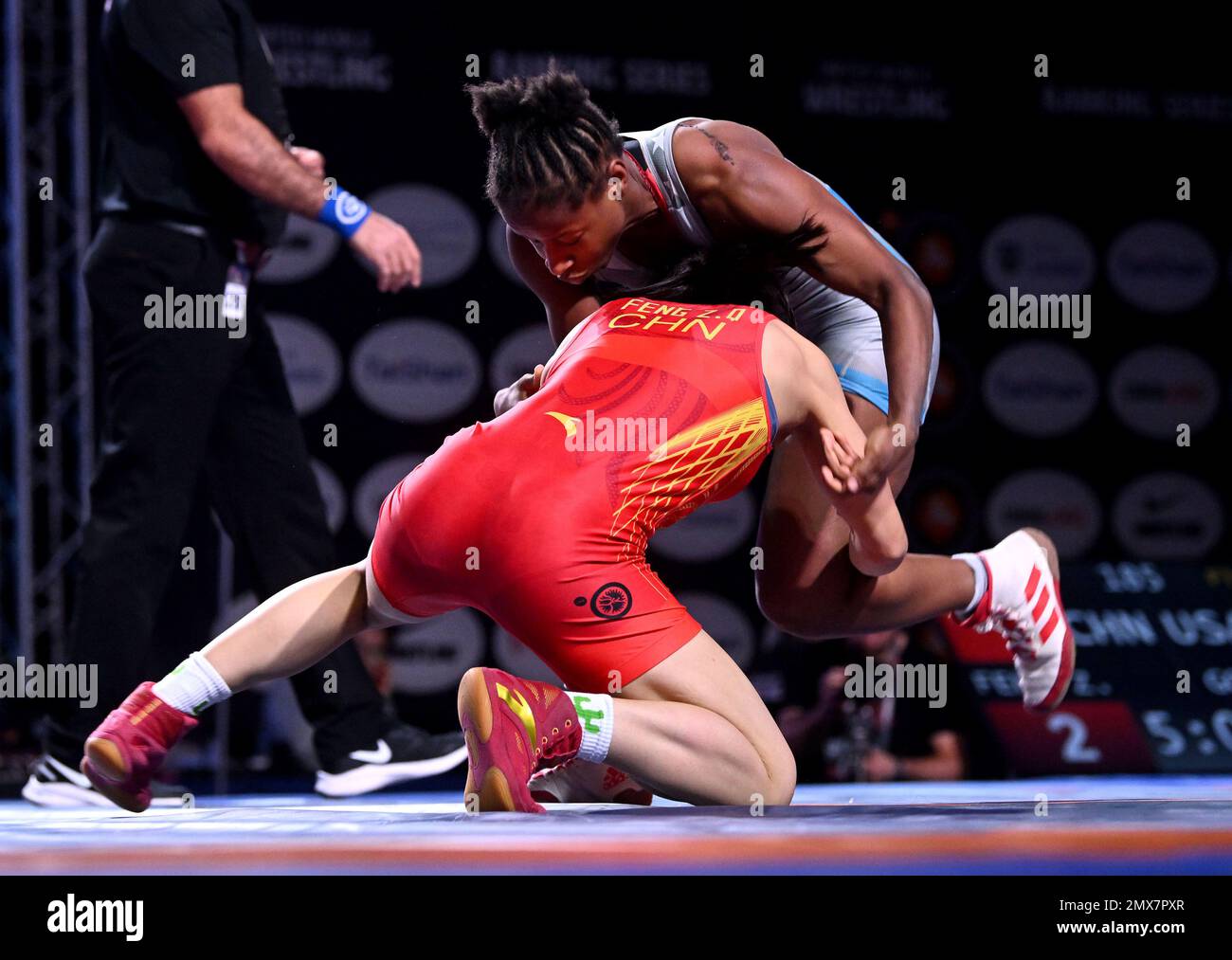 ZAGREB, CROATIA – FEBRUARY 02: Ziqi Feng of China (red) competes ...