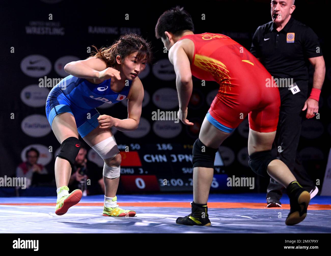 ZAGREB, CROATIA – FEBRUARY 02: Jiang Zhu of China (red) competes ...