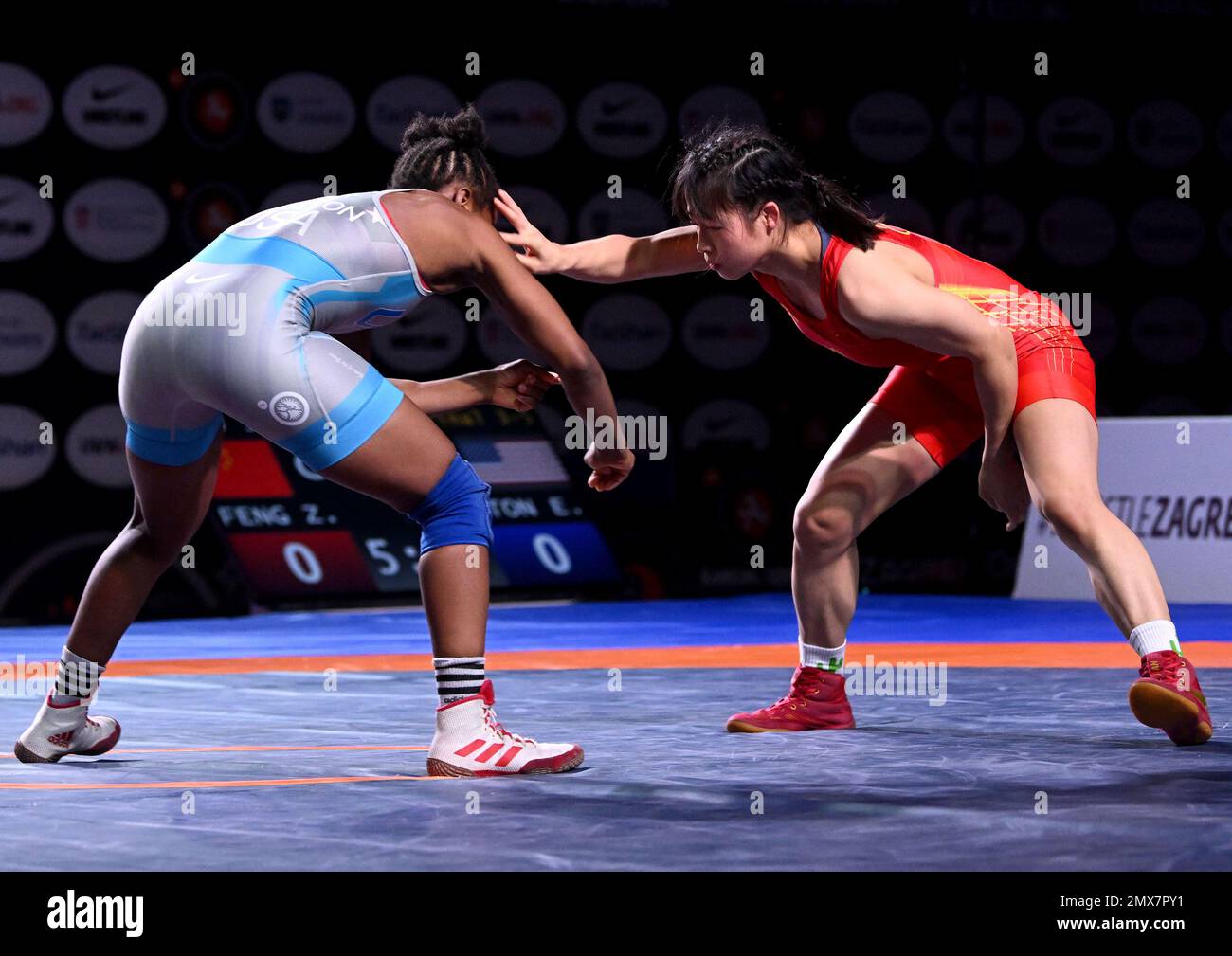 ZAGREB, CROATIA – FEBRUARY 02: Ziqi Feng of China (red) competes ...
