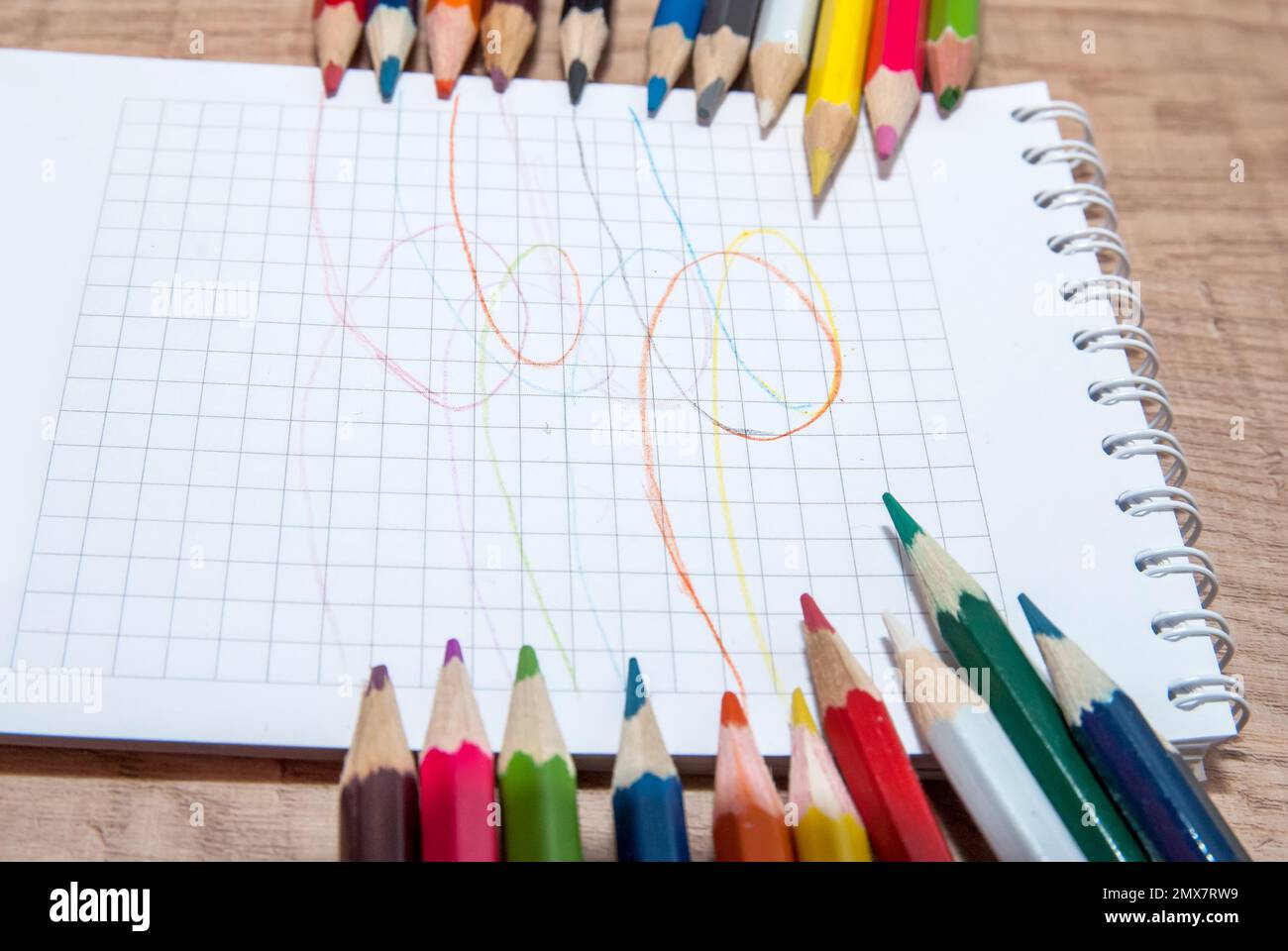 Colored pencils and paper Stock Photo - Alamy
