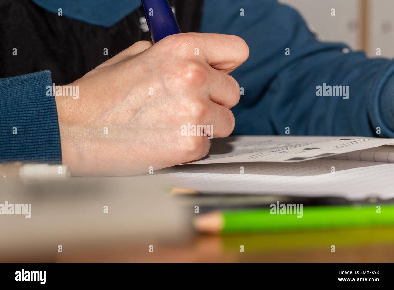 Symbol image school: Fifth grader doing his homework (model released ...