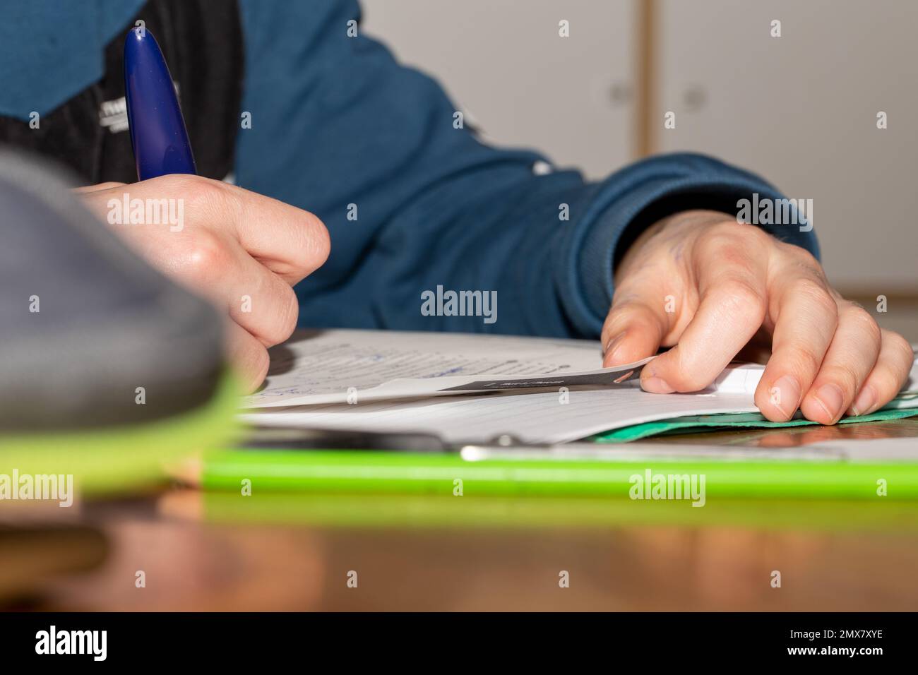 Symbol image school: Fifth grader doing his homework (model released ...