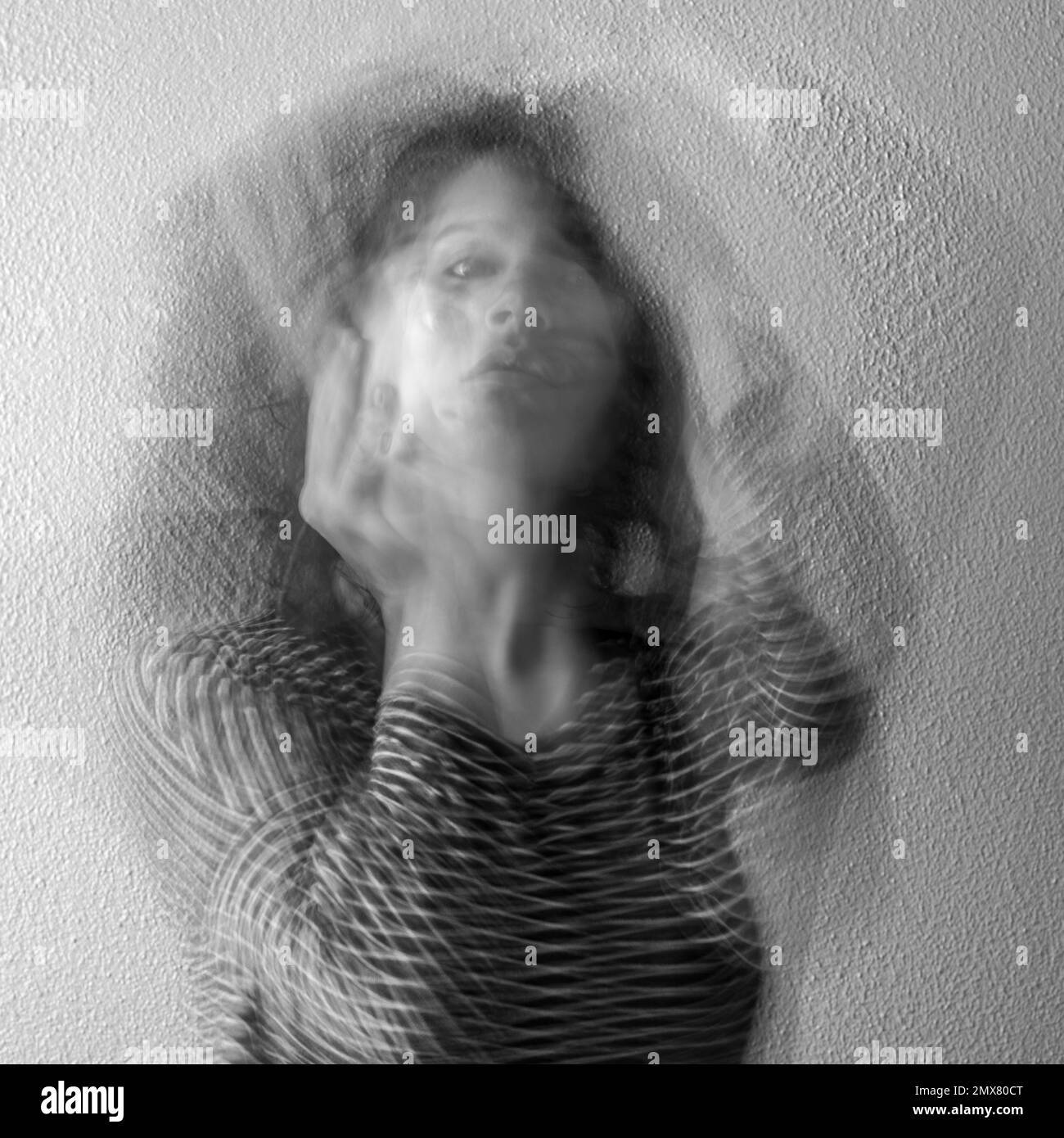 Double exposure black and white young female looking at camera while ...