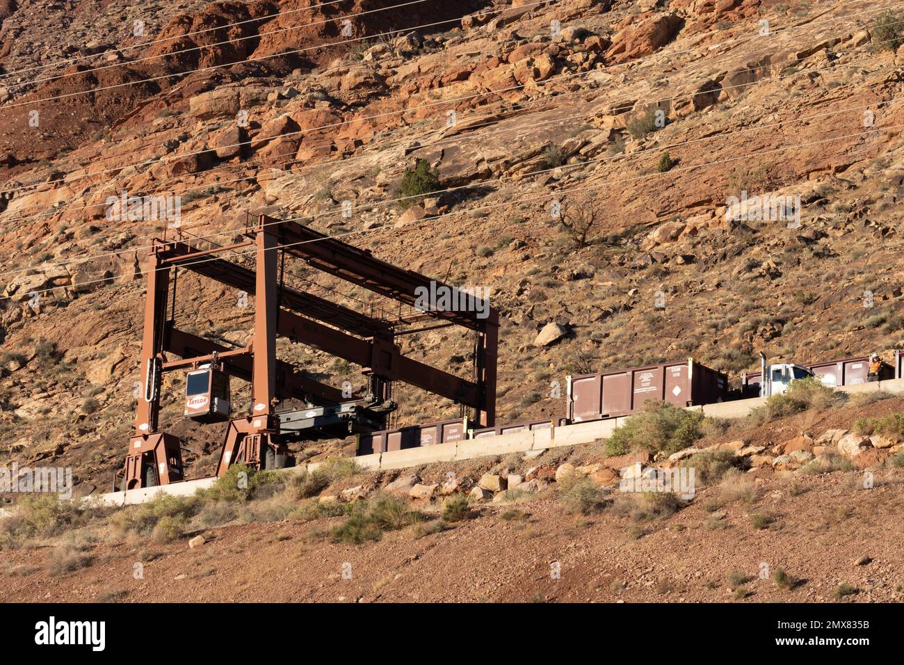 A container handler for loading sealed waste containers at the UMTRA radioactive mill taillings ...