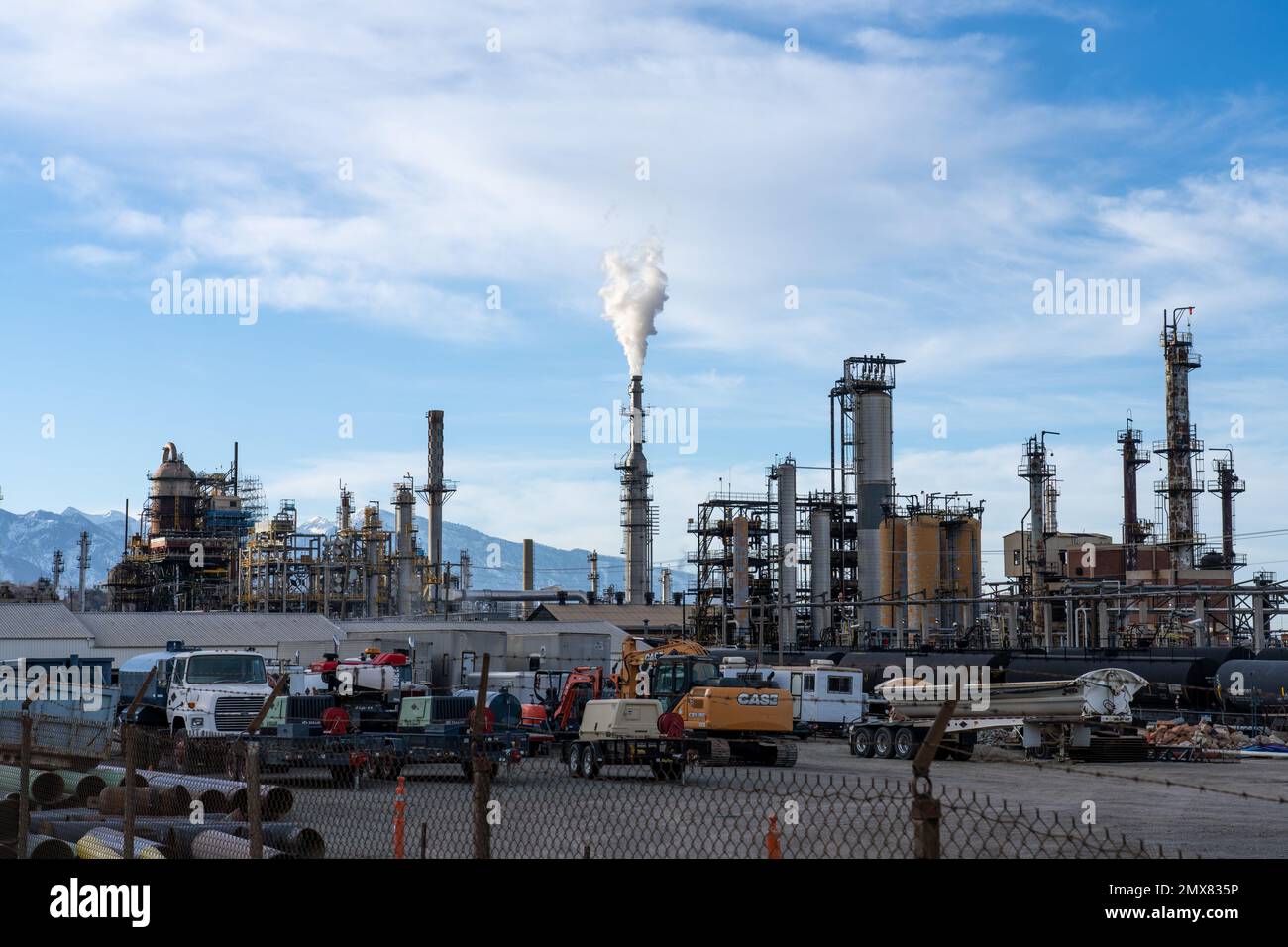 Steam comes from a tower in oil refinery near Salt Lake City, Utah ...