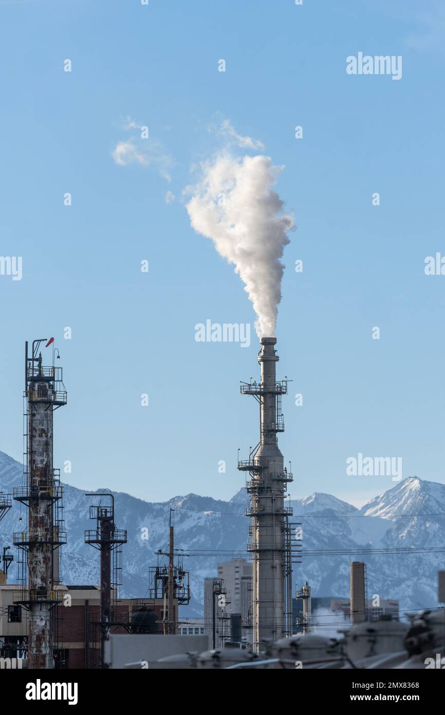 Steam comes from a tower in oil refinery near Salt Lake City, Utah ...