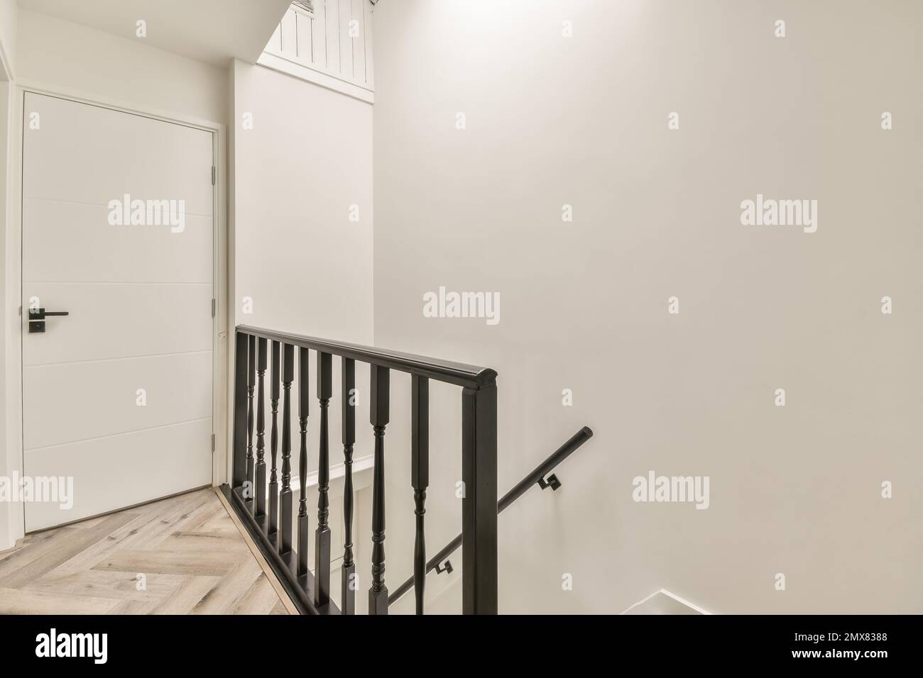 Interior design of hallway with white walls and staircase leading to ...