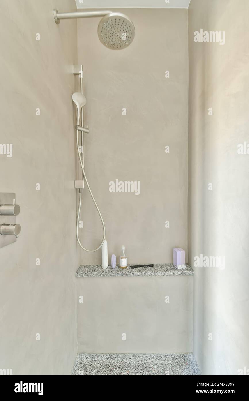 Interior design of small shower cabin with beige walls and shelf for ...