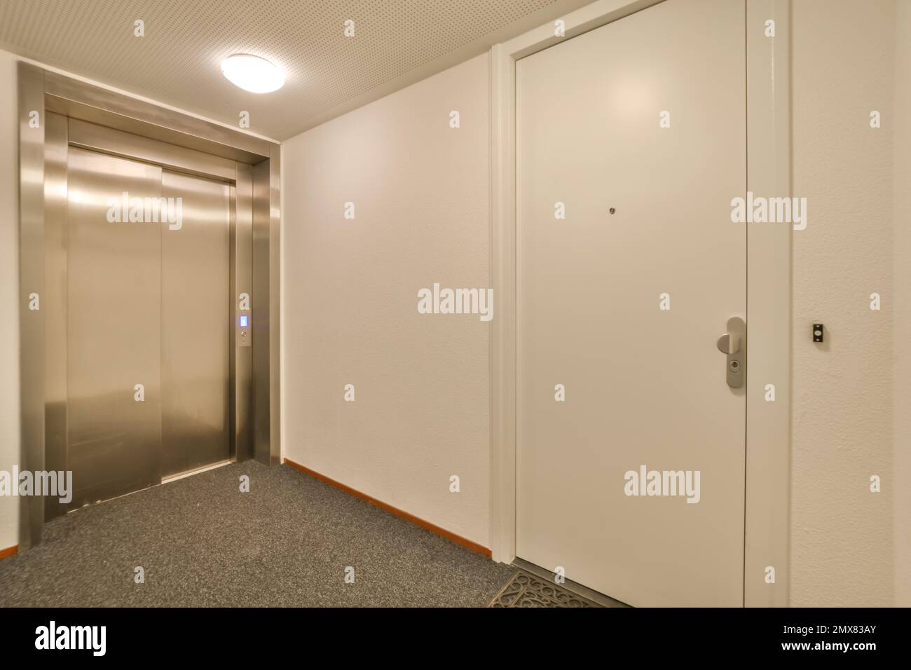 Interior design of modern hallway with doorway and elevator in ...