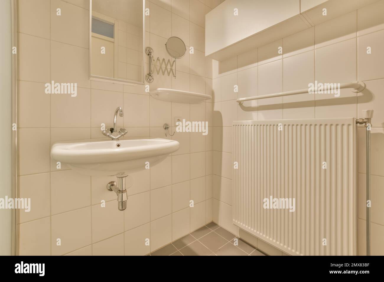 Interior design of light restroom with ceramic sink under mirror and ...