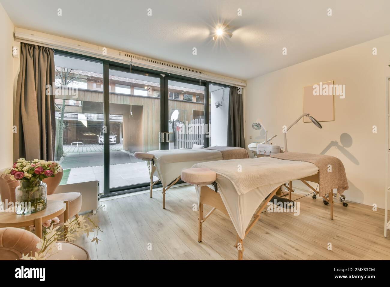 Beauty salon room with table by the window with white walls Stock Photo ...