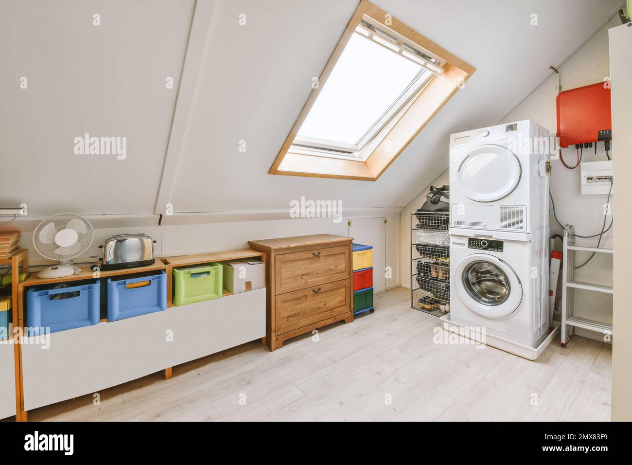 Modern laundry room interior design with washing machines and shelf ...