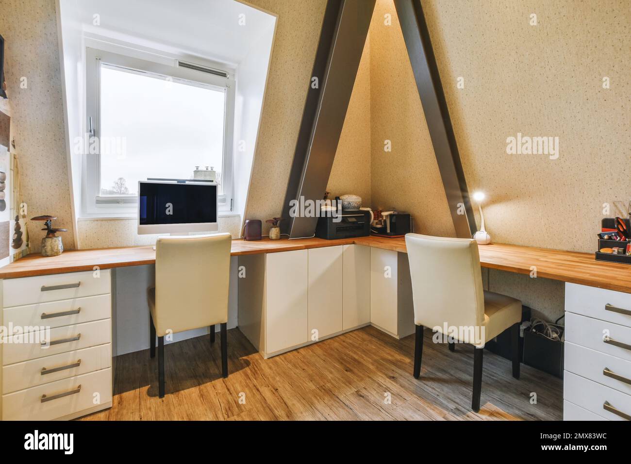 Interior of contemporary office with wooden tables and chairs located ...