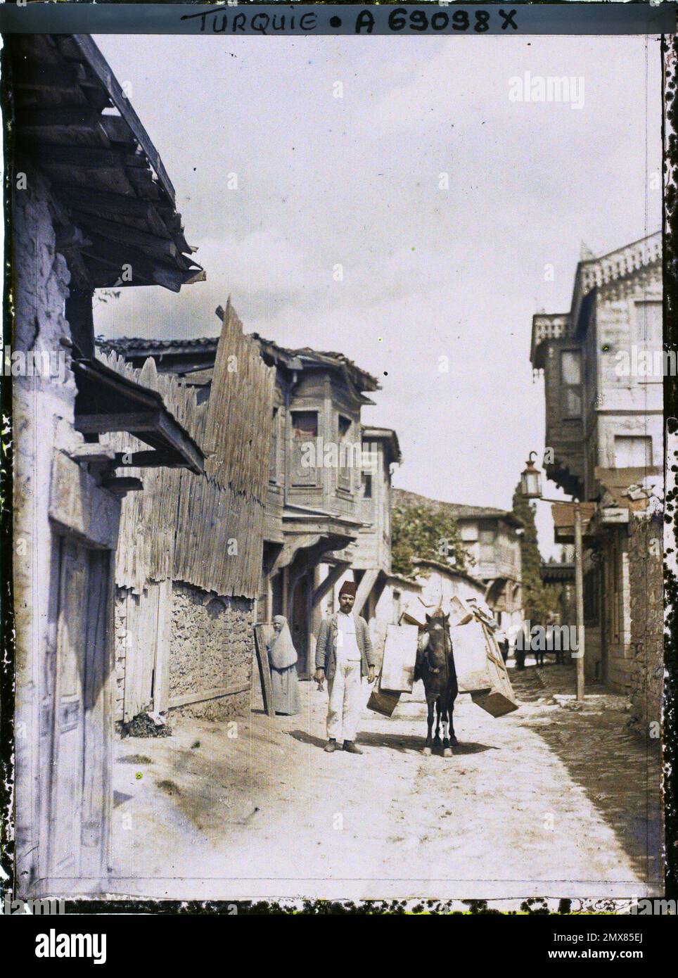 Constantinople (current Istanbul), Turkey a man leading a mule heavily ...
