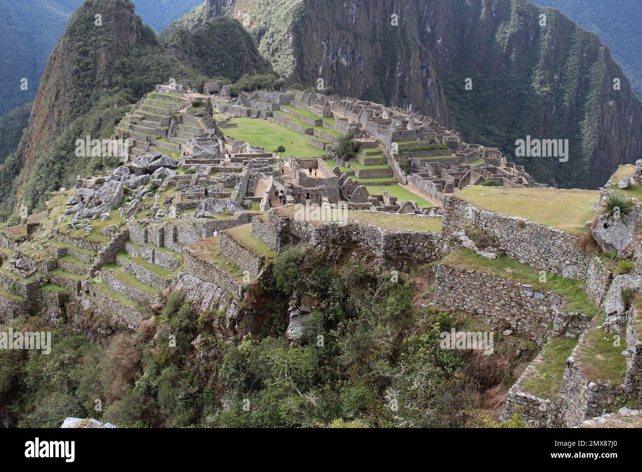 An aerial, back view of Machu Picchu's Main Square, Intihuatana, The ...