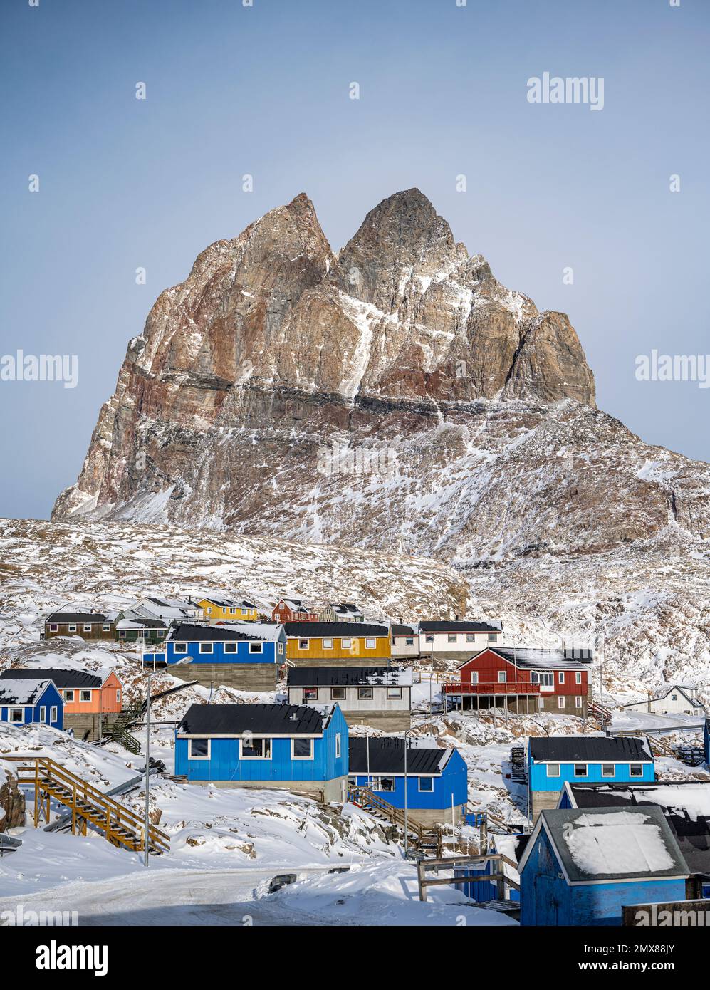 Colourful houses clinging to the side of the mountain at Uummannaq in ...