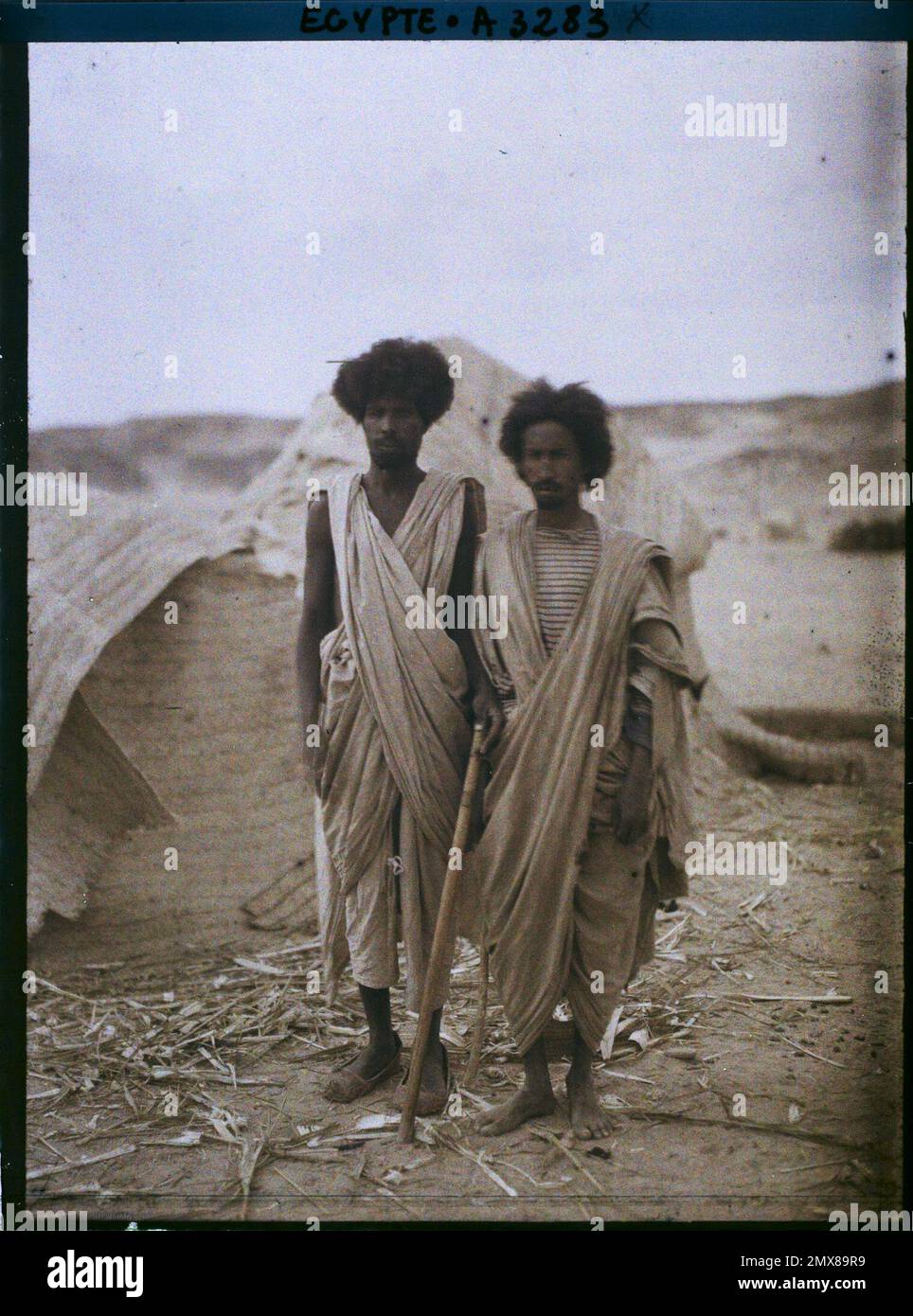 ASSOUAN, Egypt, Africa two bishari men posing in front of a house ...