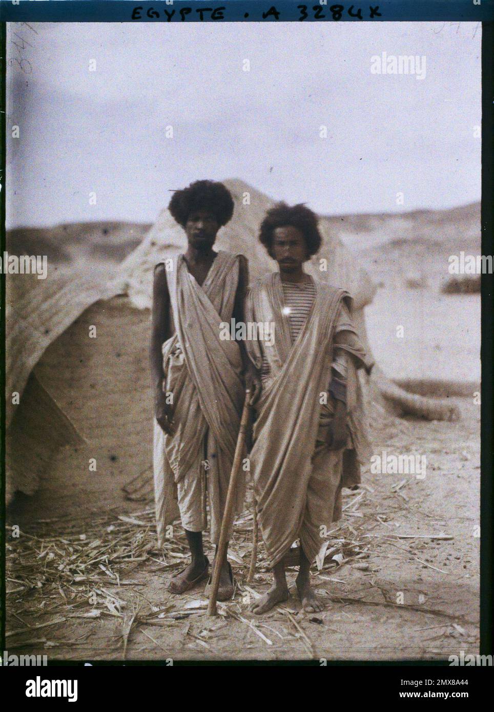 ASSOUAN, Egypt, Africa two bishari men posing in front of a house ...