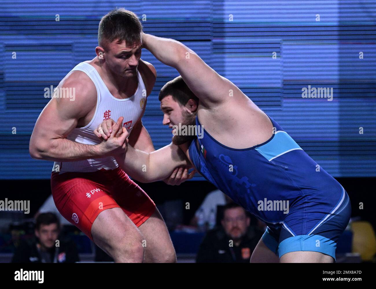 ZAGREB, CROATIA – FEBRUARY 02: Robert Baran of Poland (red) competes ...