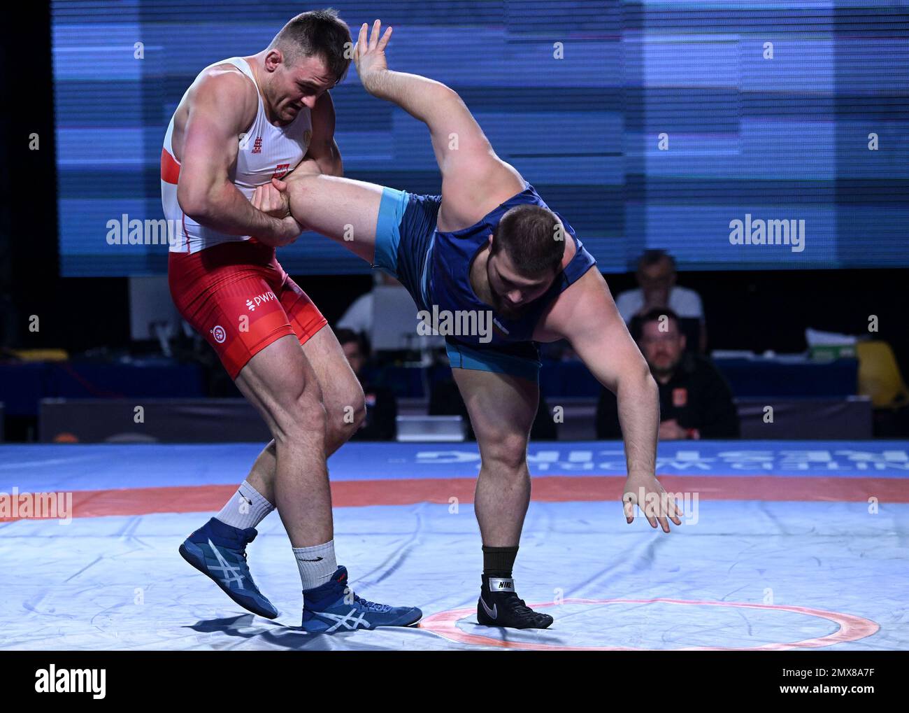 ZAGREB, CROATIA – FEBRUARY 02: Robert Baran of Poland (red) competes ...