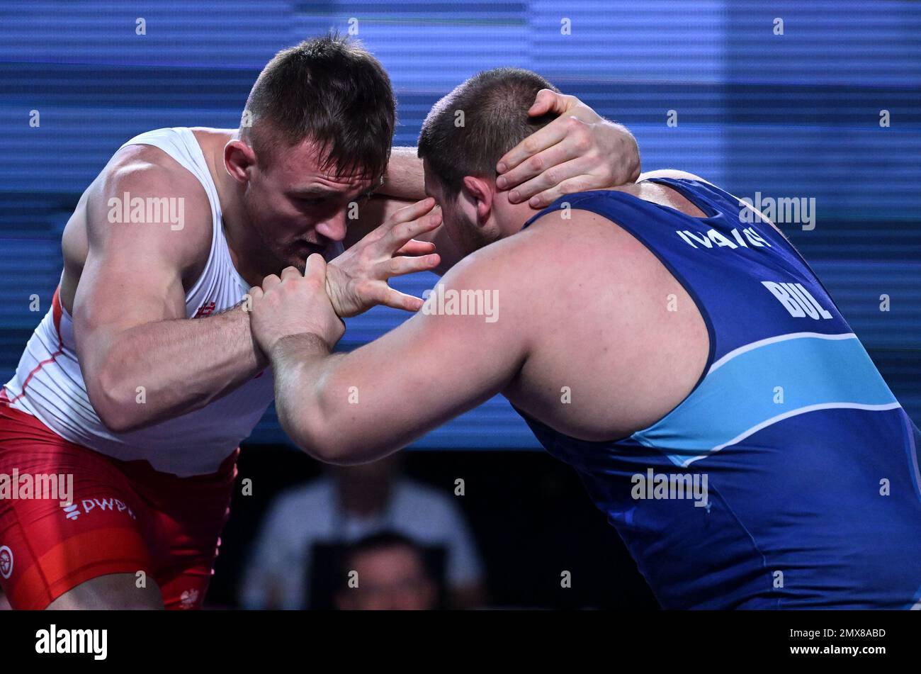 ZAGREB, CROATIA – FEBRUARY 02: Robert Baran of Poland (red) competes ...