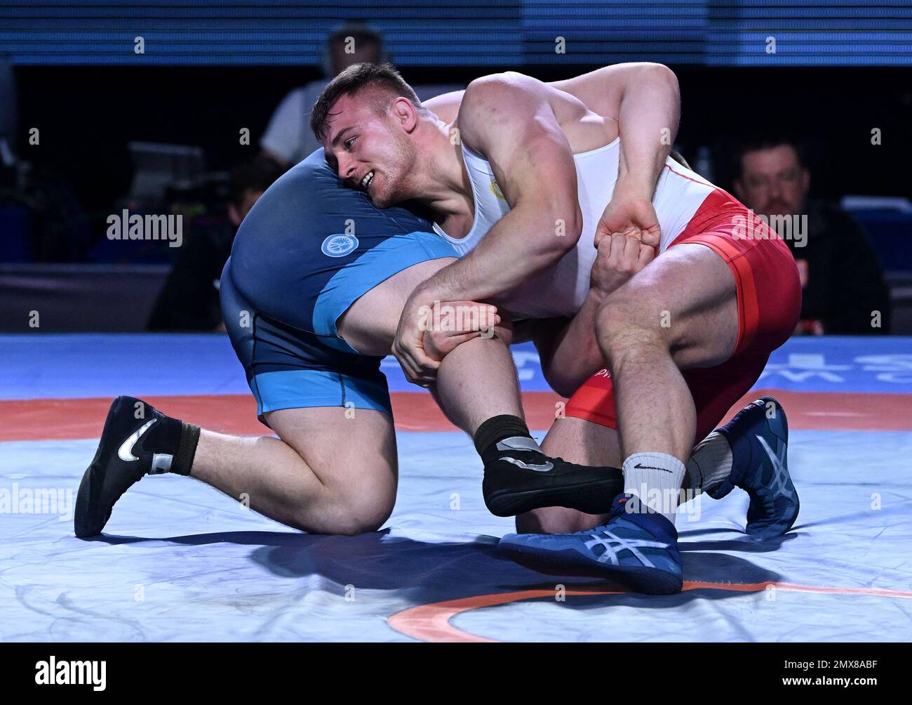 ZAGREB, CROATIA – FEBRUARY 02: Robert Baran of Poland (red) competes ...