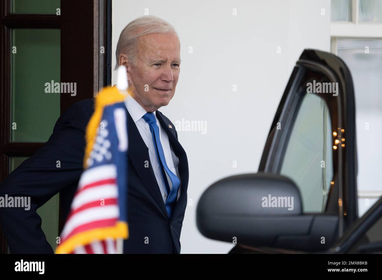 President Joe Biden walks out of the West Wing of the White House with ...