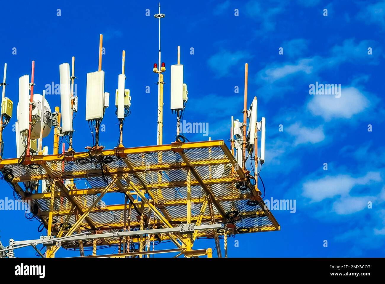 Red white 5G tower with blue sky background radiation kills us in ...