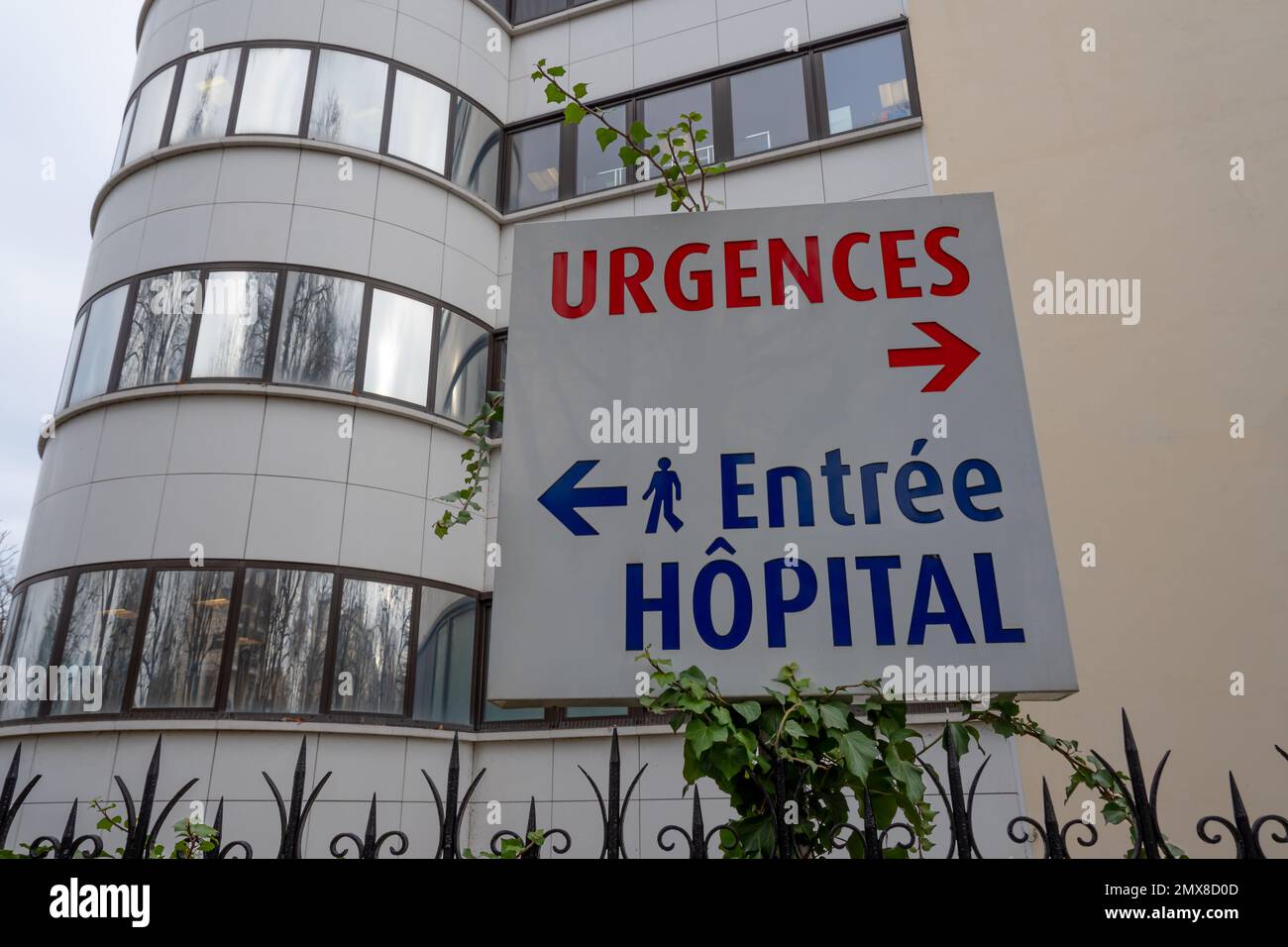 Sign written in French indicating the directions of the emergencies ...