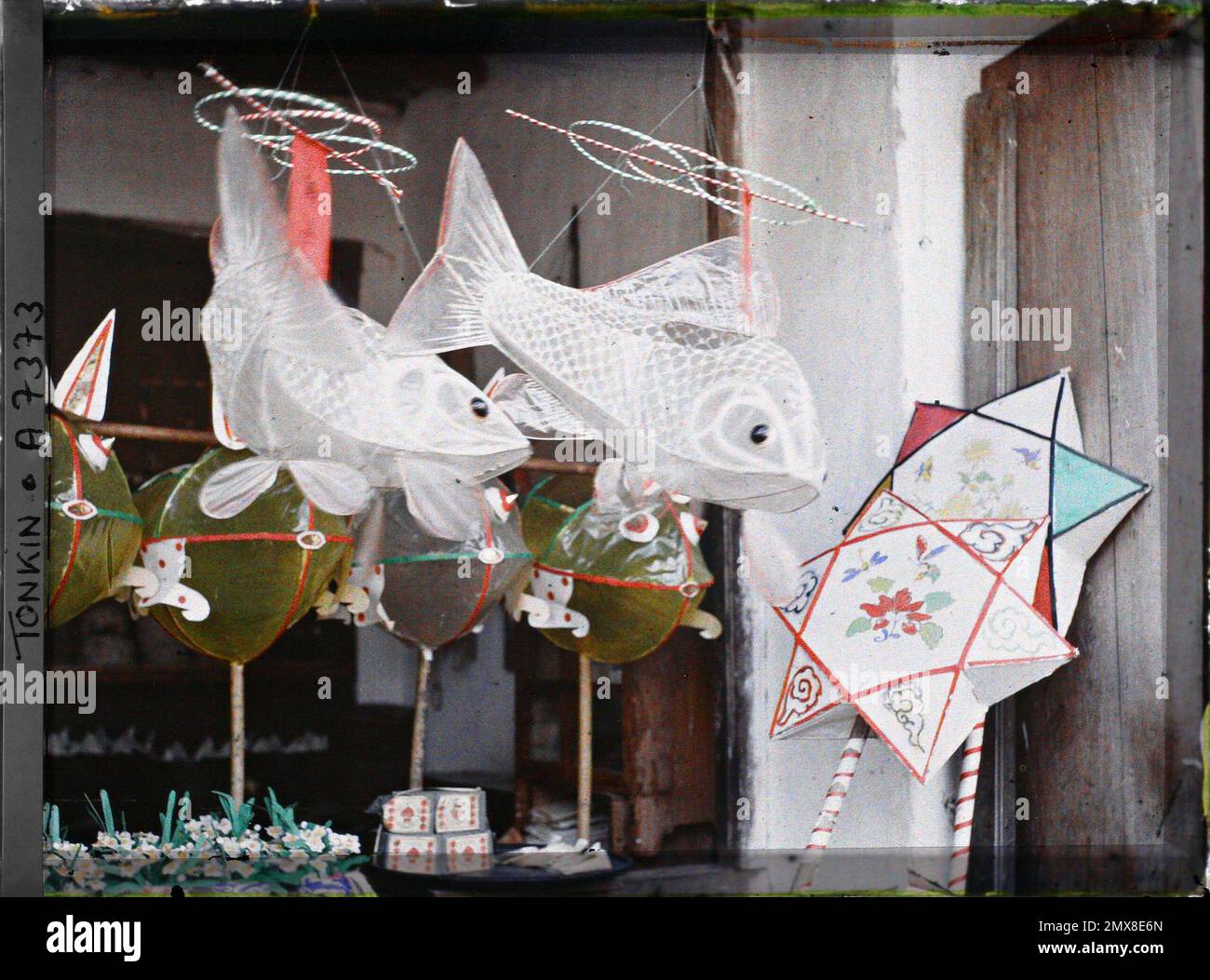 Hà-Nôi, Tonkin, Indochine A display of oiled paper toys in front of a ...