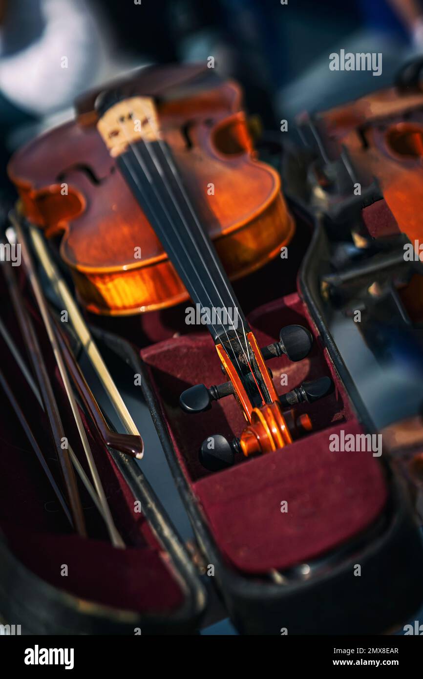 Abstract blurred background of Violin and bow in dark red case ...