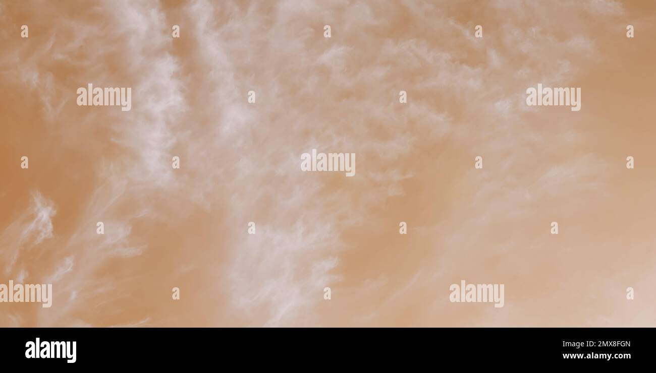 The warm color of a fairy-tale sky with light feathery clouds. Sky ...