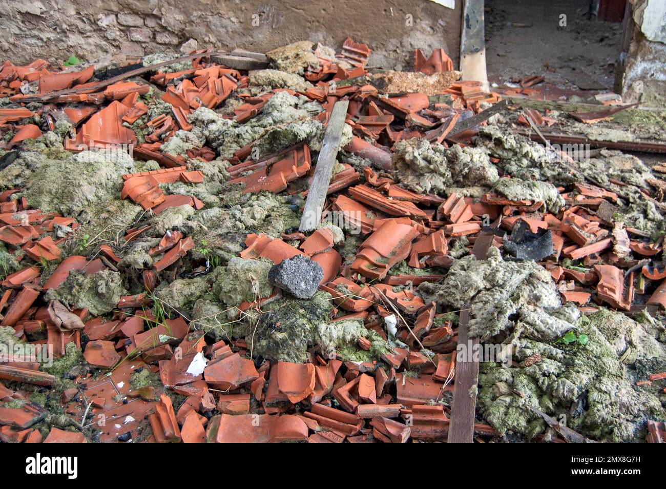 A pile of broken roof tiles from a demolished building Stock Photo - Alamy