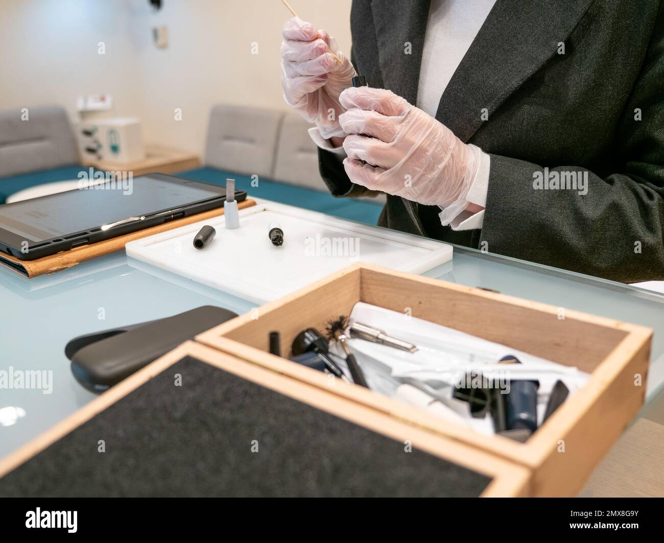 Cleaning and maintenance of tobacco heating system Stock Photo - Alamy