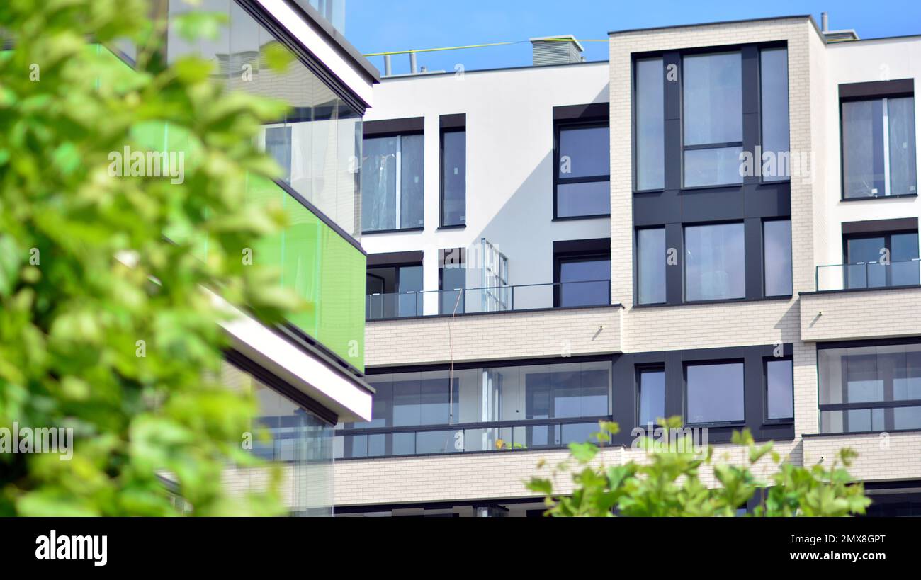 Modern residential building with new apartments in a green residential ...