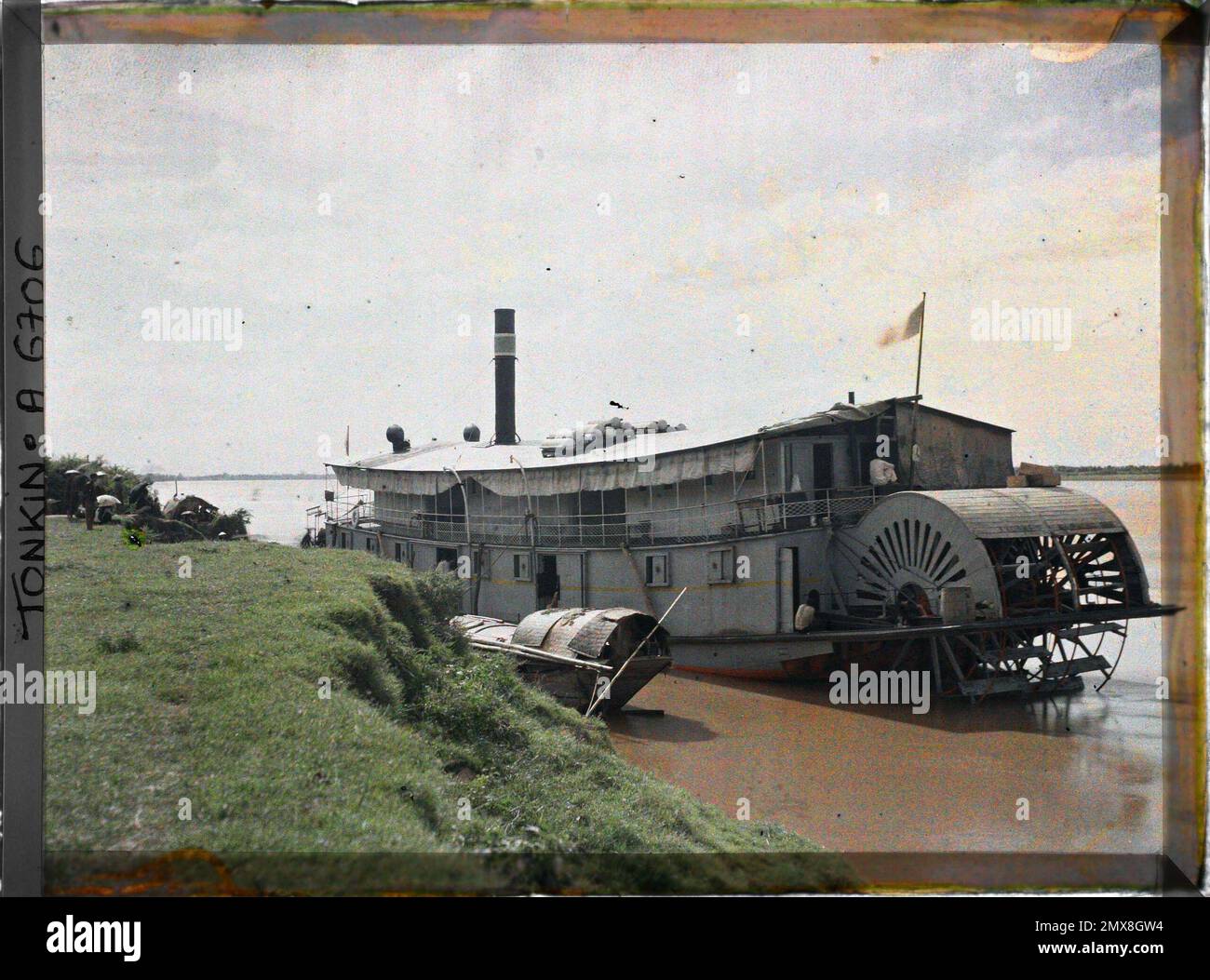 So 'n-tâi, Tonkin, Indochina A dawn boat and a sampan anchored by the ...