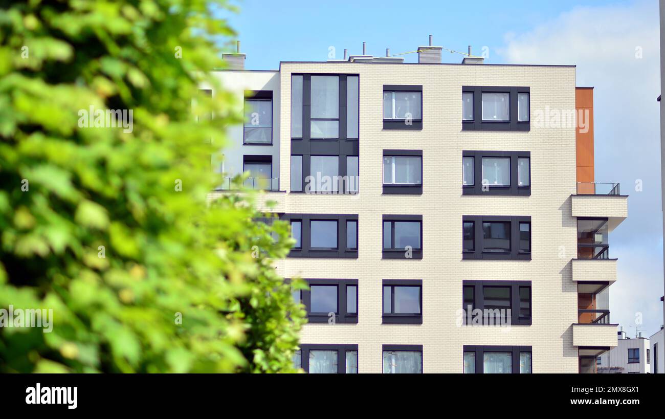 Modern residential building with new apartments in a green residential ...