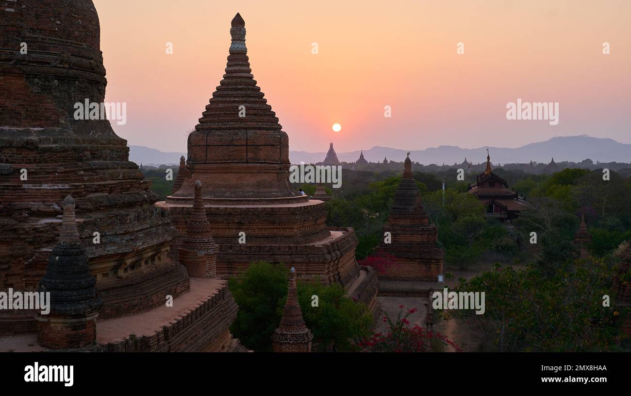 View of ancient buddhist temples in Bagan at sunset Stock Photo - Alamy