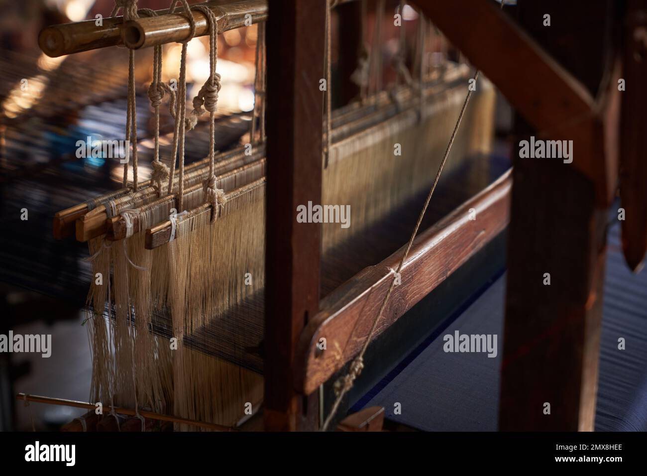 Traditional silk loom for weaving textiles inside a workshop in Lake ...