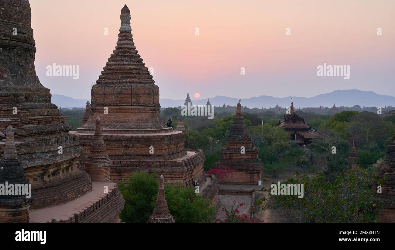 View of ancient buddhist temples in Bagan at sunset Stock Photo - Alamy