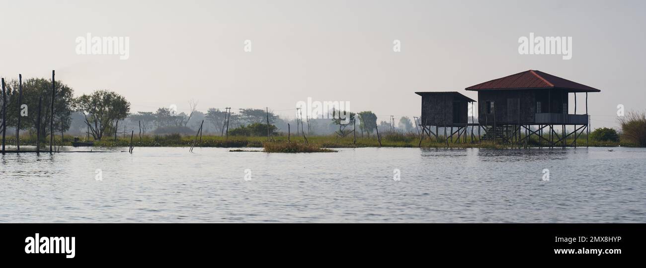 An old traditional Burmese house on stilts outside of a floating ...