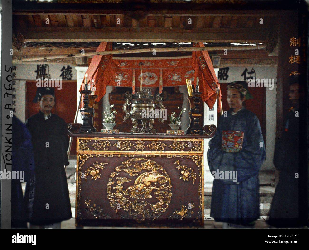 Xa-La, Tonkin, Indochine Two officiants around the inner altar, at the ...