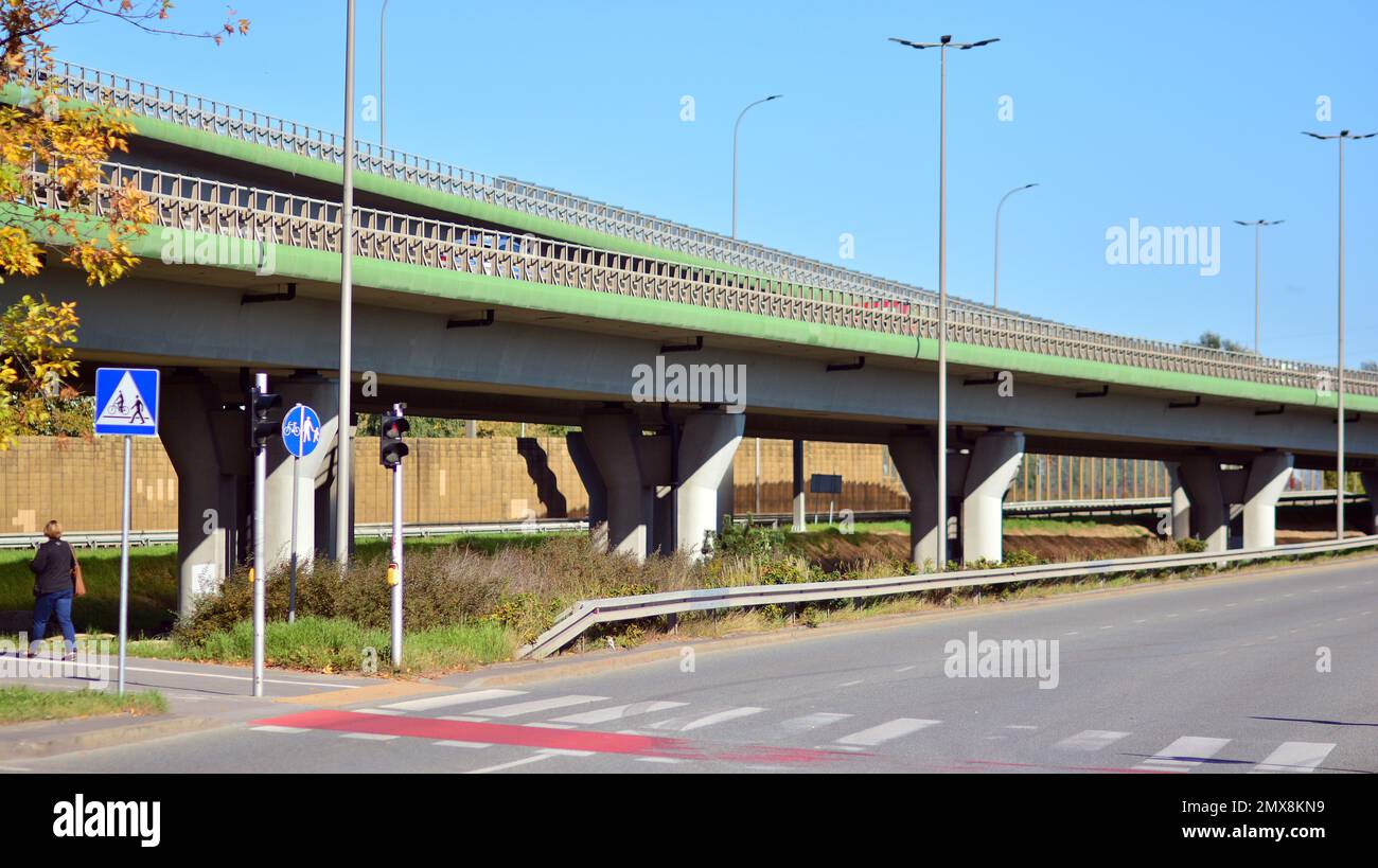 Bridge against the blue sky. Motorway flyover. Elevated roads on sunny ...