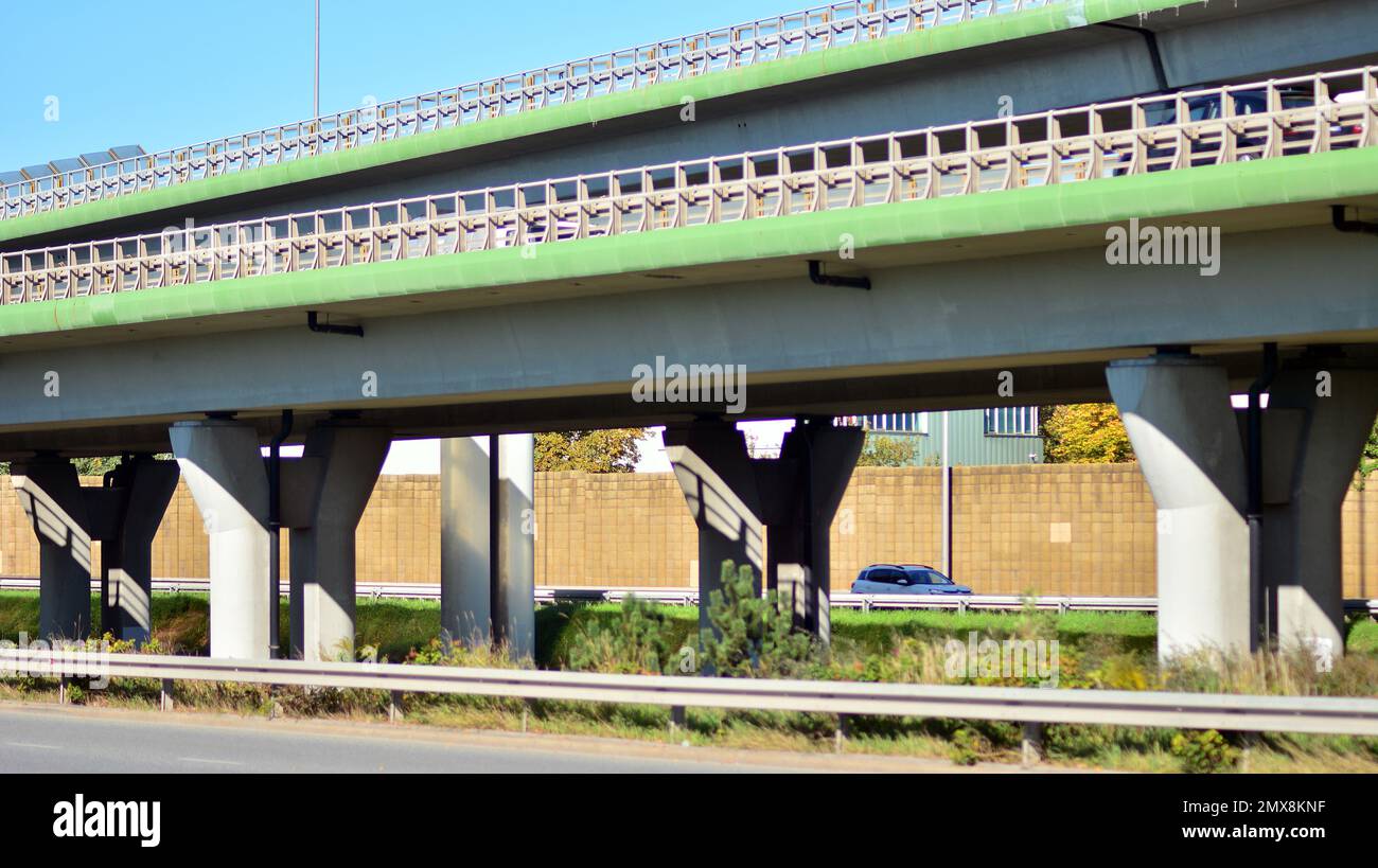 Bridge against the blue sky. Motorway flyover. Elevated roads on sunny ...