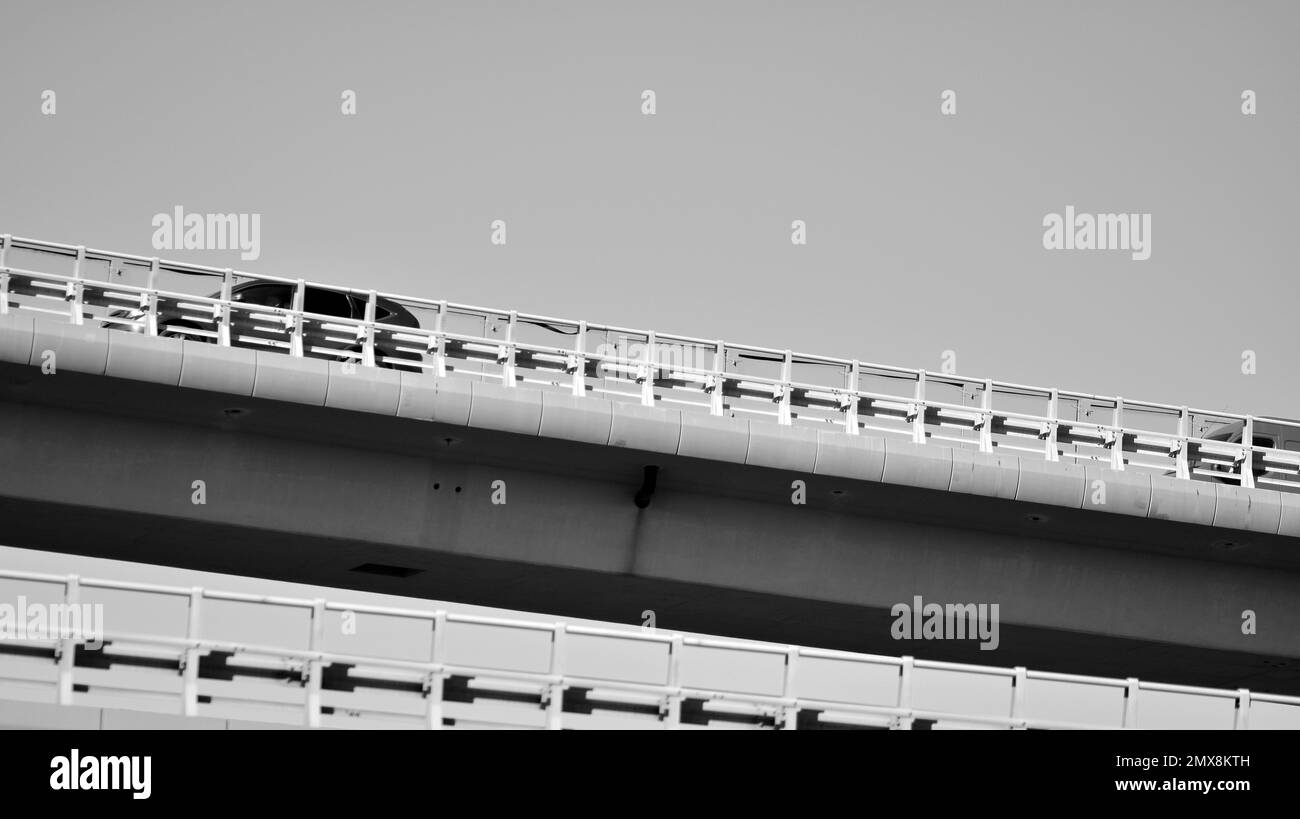Bridge against the blue sky. Motorway flyover. Elevated roads on sunny ...
