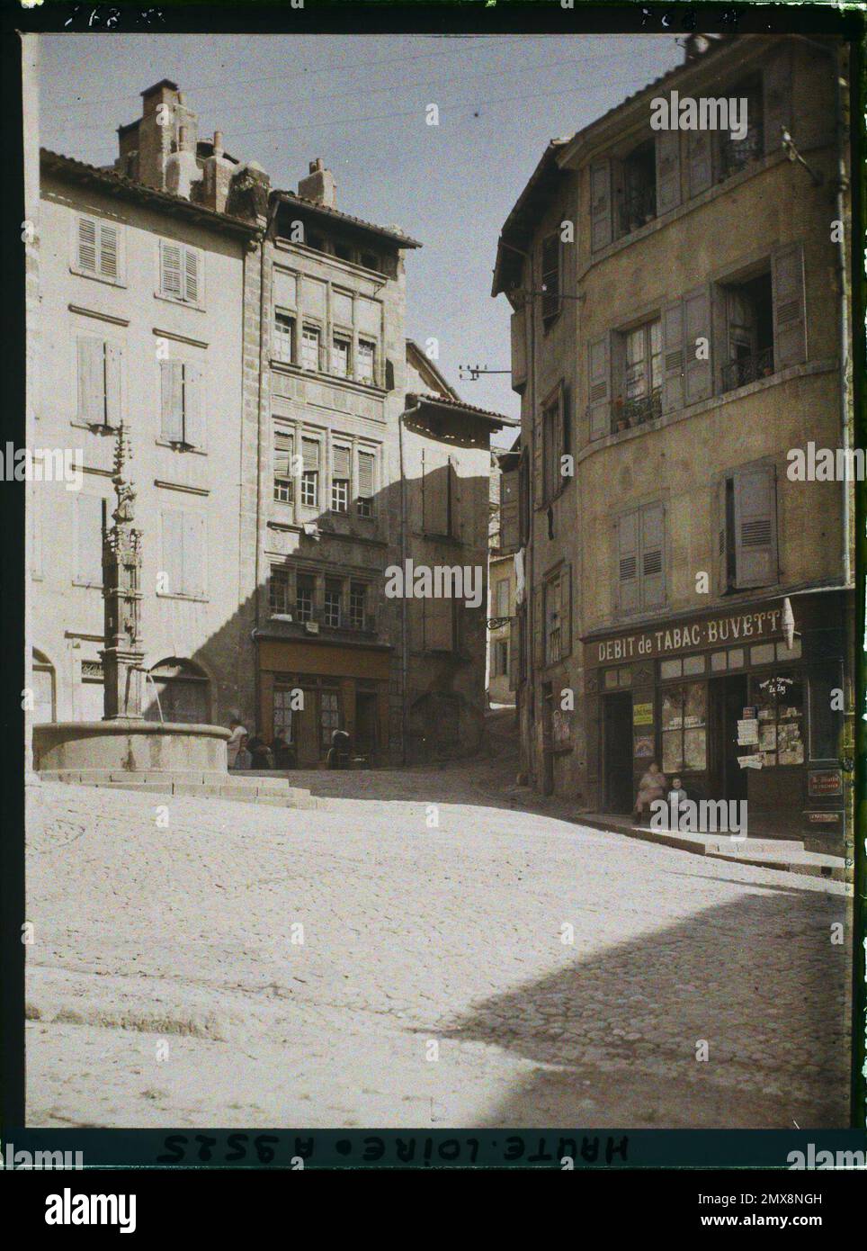 Le Puy-en-Velay, France La Fontaine des Tables with the background of ...