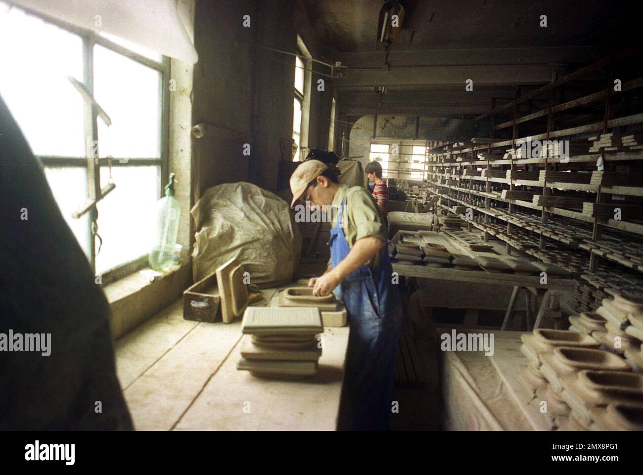 Medias, Sibiu County, Romania, approx. 2000. Workers making terracotta ...