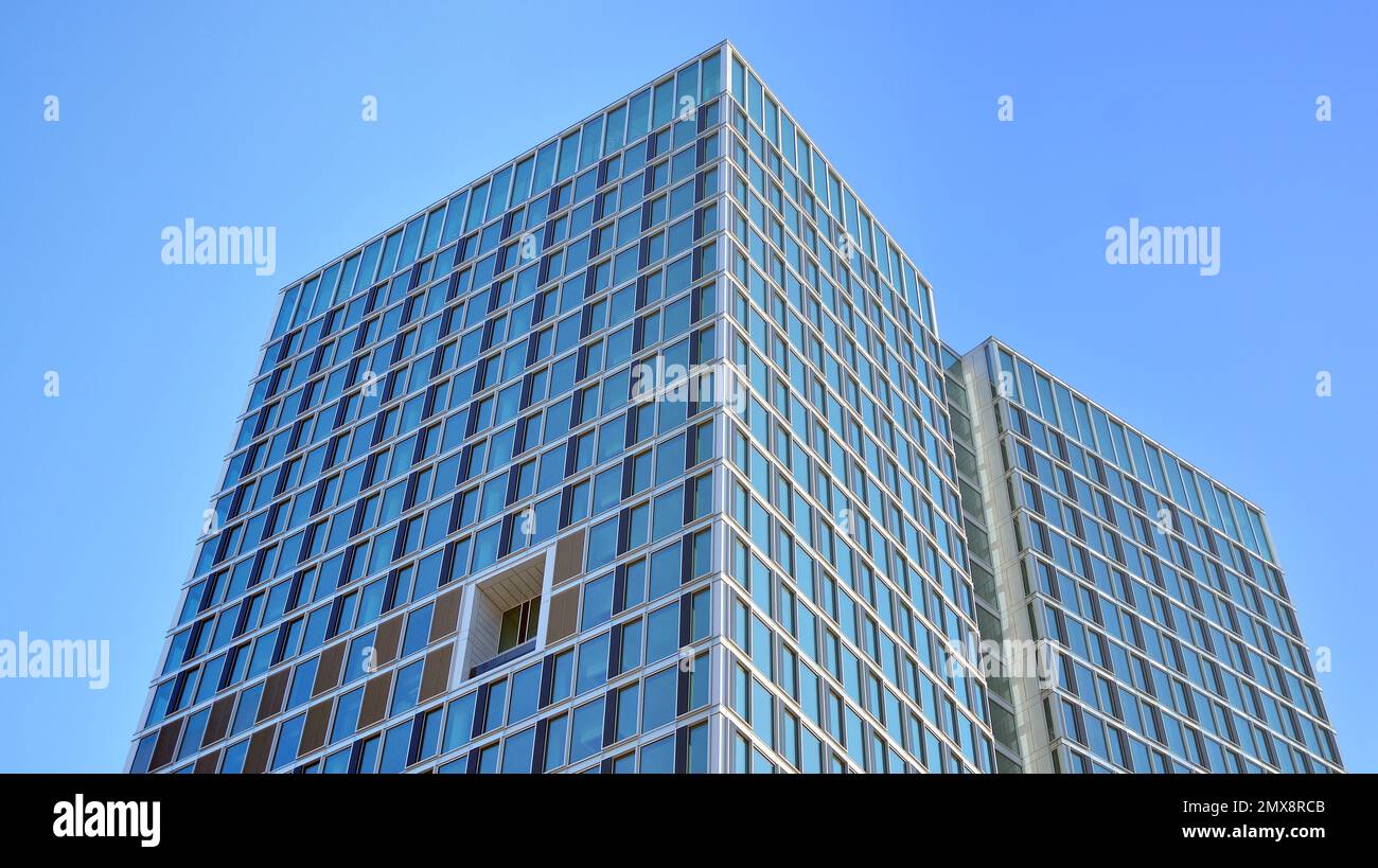 Architecture details. Modern glass building facade in sunny day ...