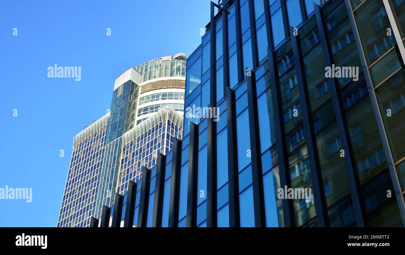 Architecture details. Modern glass building facade in sunny day ...